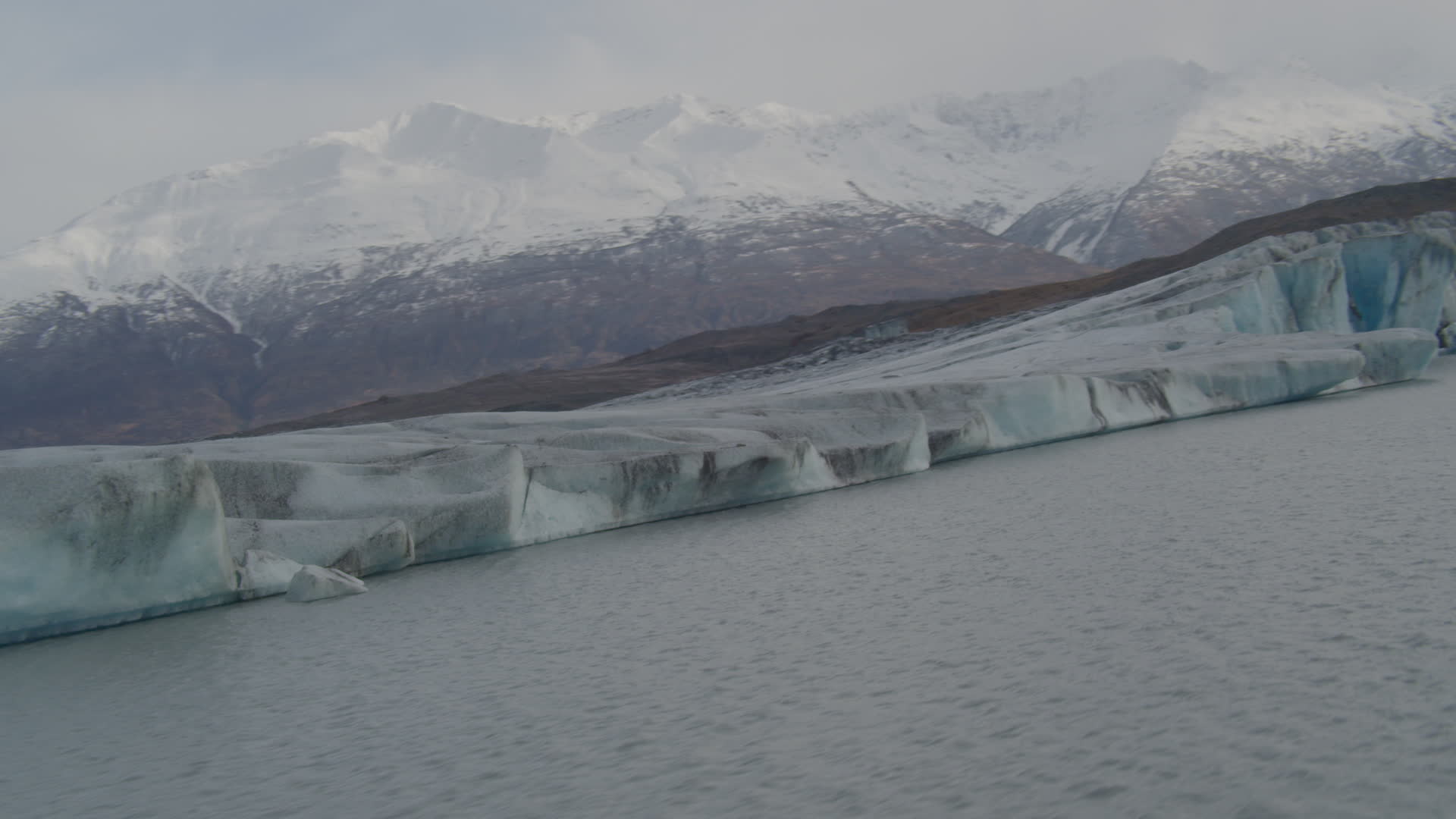 4K stock footage aerial video flying low over Knik River, pan left ...
