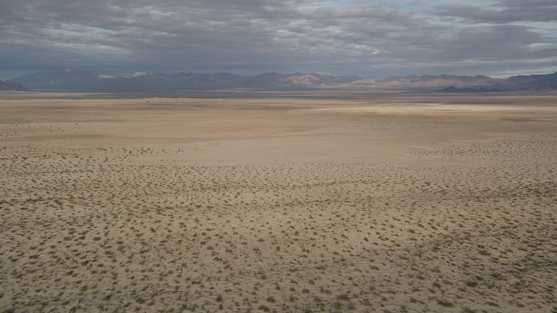 5K stock footage aerial video fly low over open desert, Mojave Desert ...