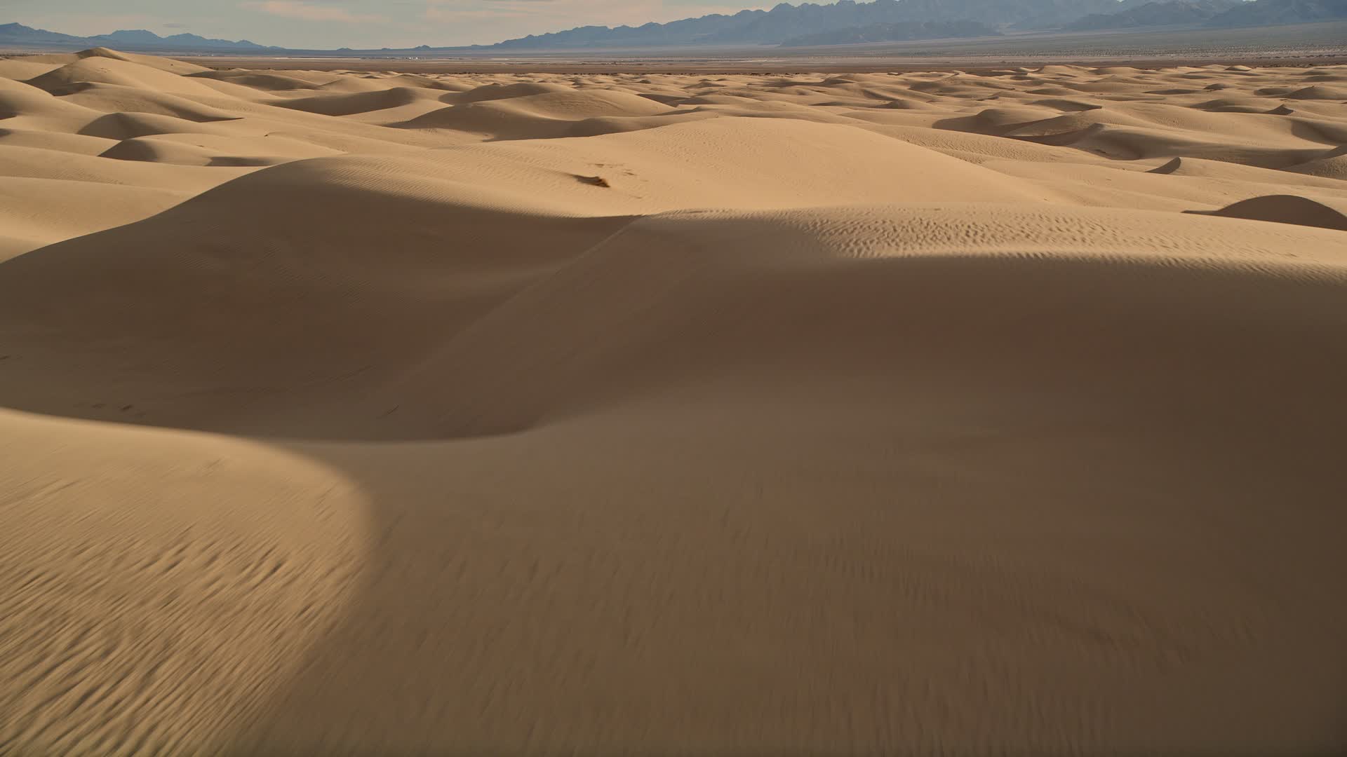 5K stock footage aerial video of flying over sand dunes, Kelso Dunes ...