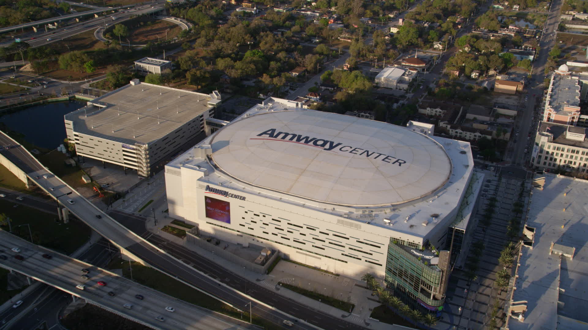 5K stock footage aerial video approach Amway Center in Downtown Orlando ...