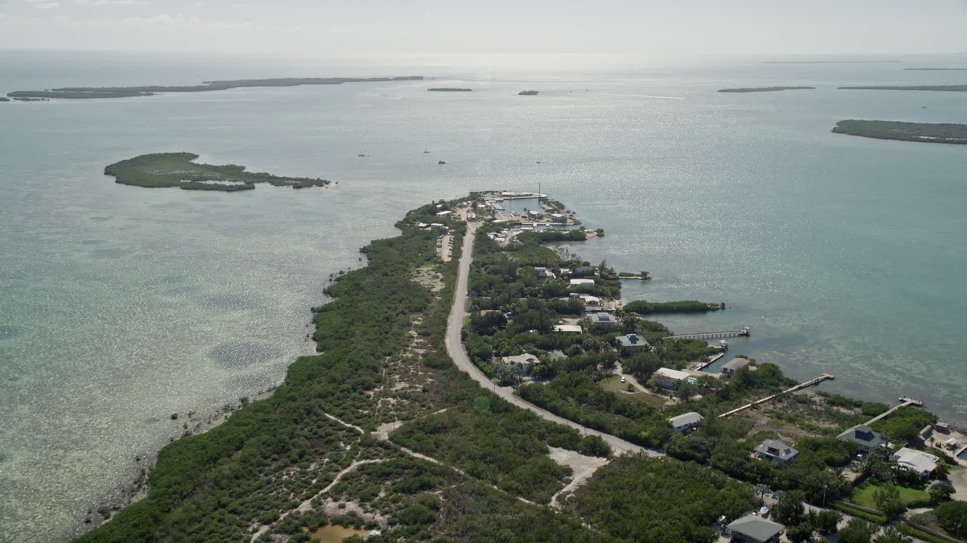 5K stock footage aerial video of approaching homes and small marina ...