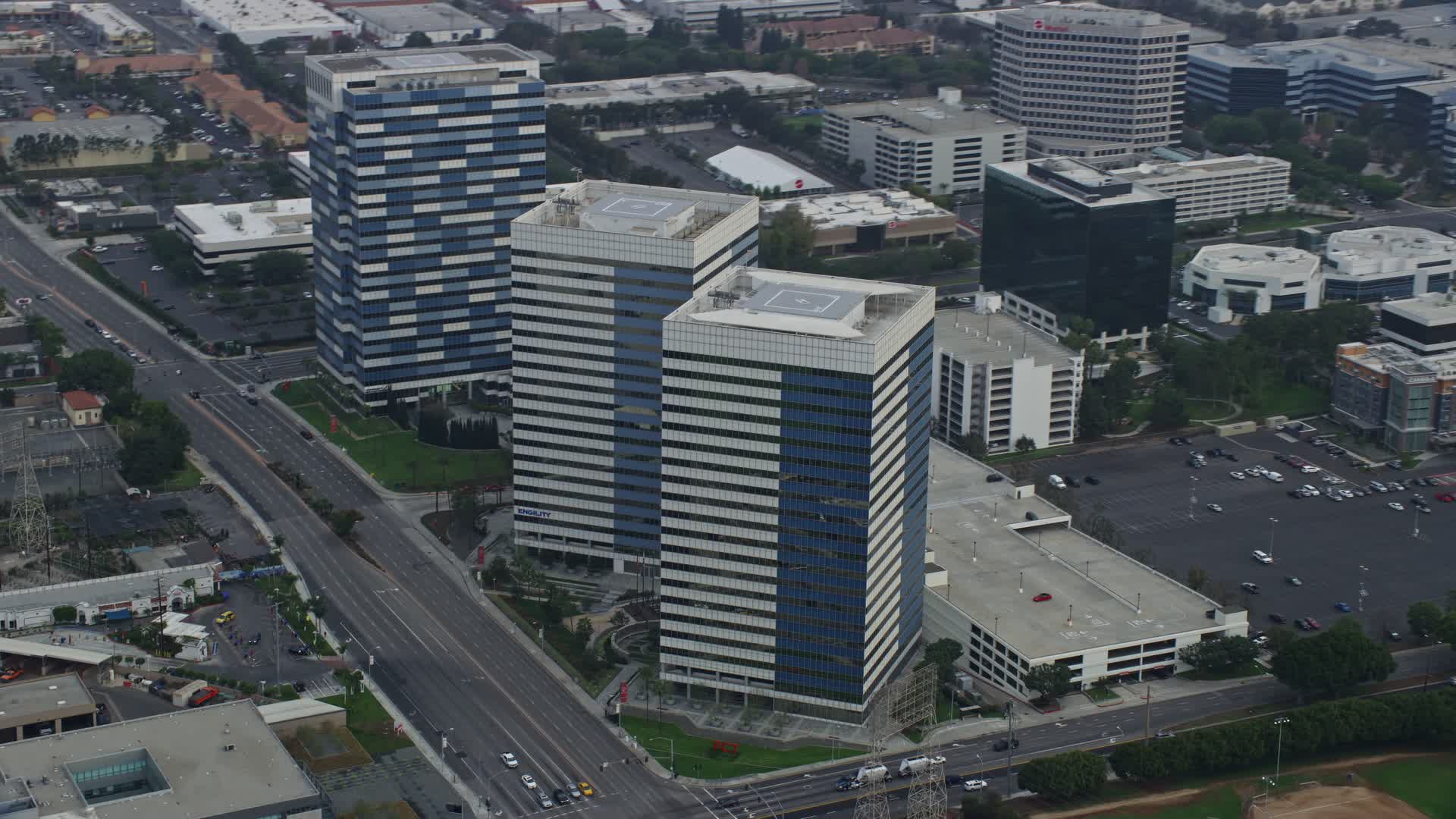 8K stock footage aerial video flying past office buildings in El ...