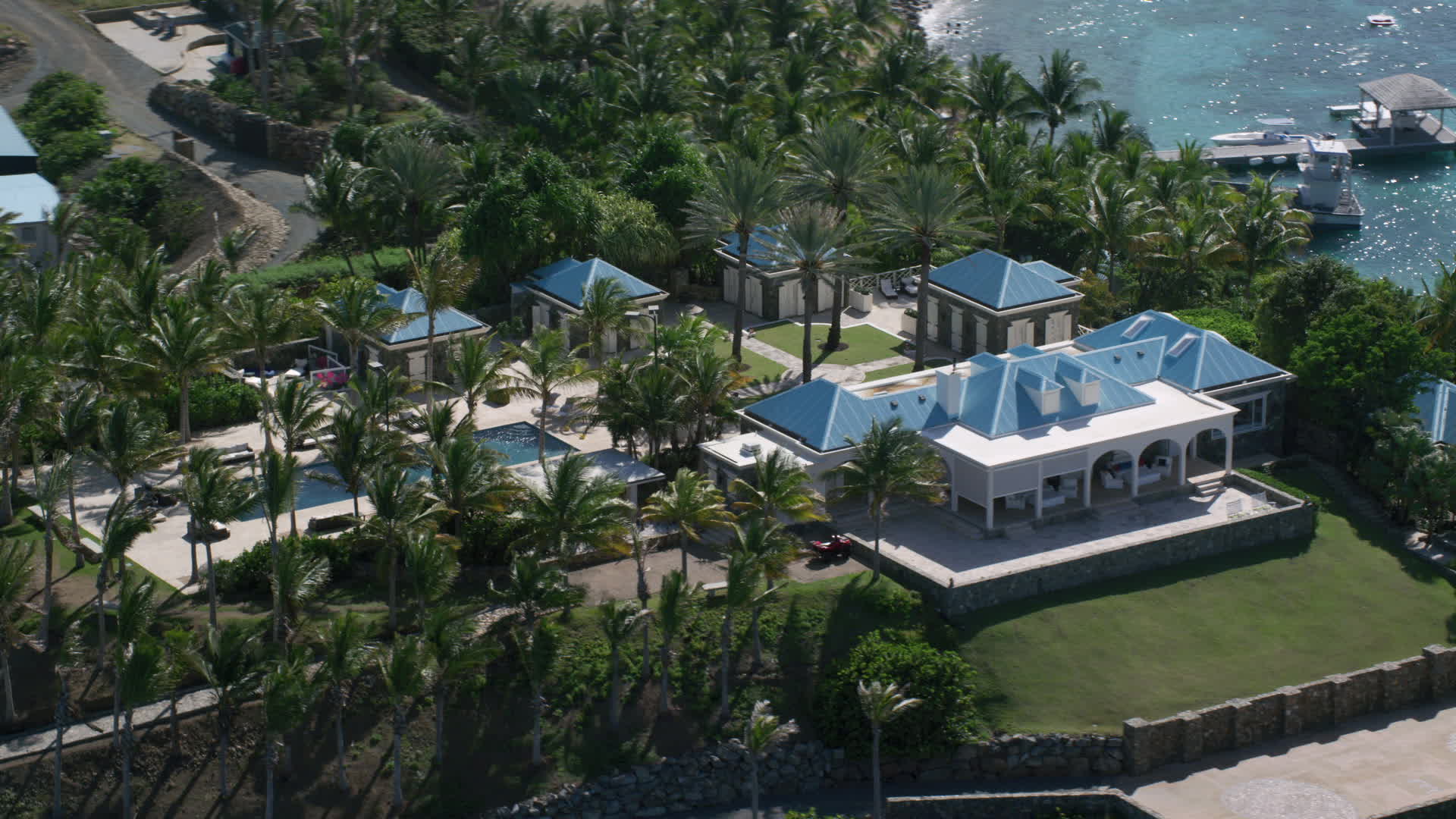 4.8K stock footage aerial video of an Oceanfront mansion and palm trees ...