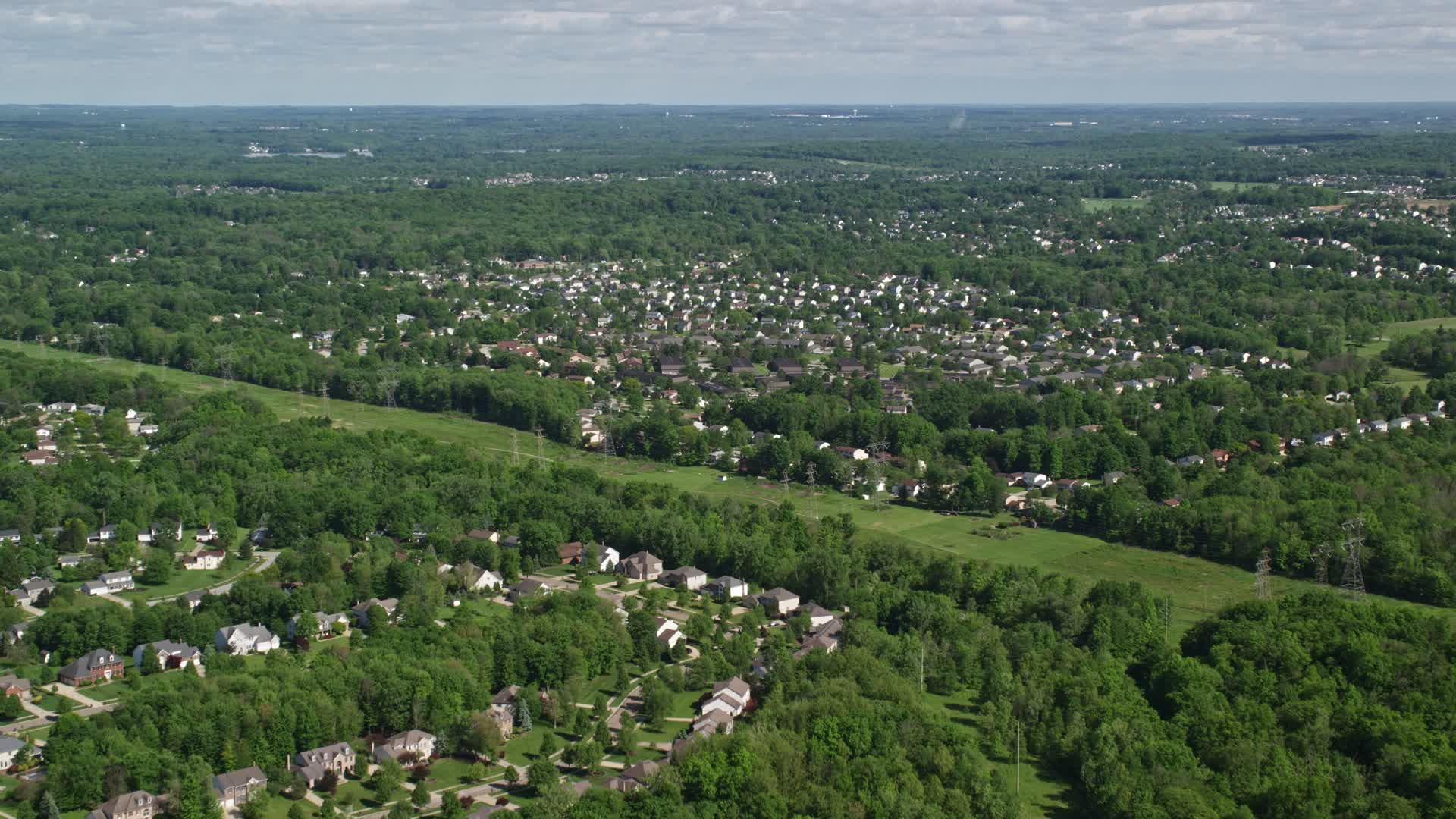 4.8K stock footage aerial video of a suburban neighborhood among trees ...