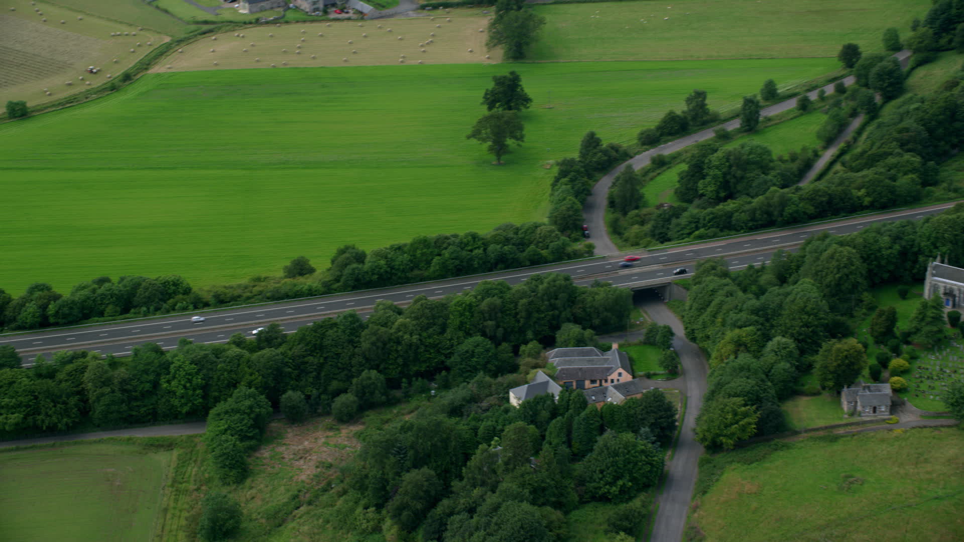 5.5K stock footage aerial video of M9 Highway lined with trees ...