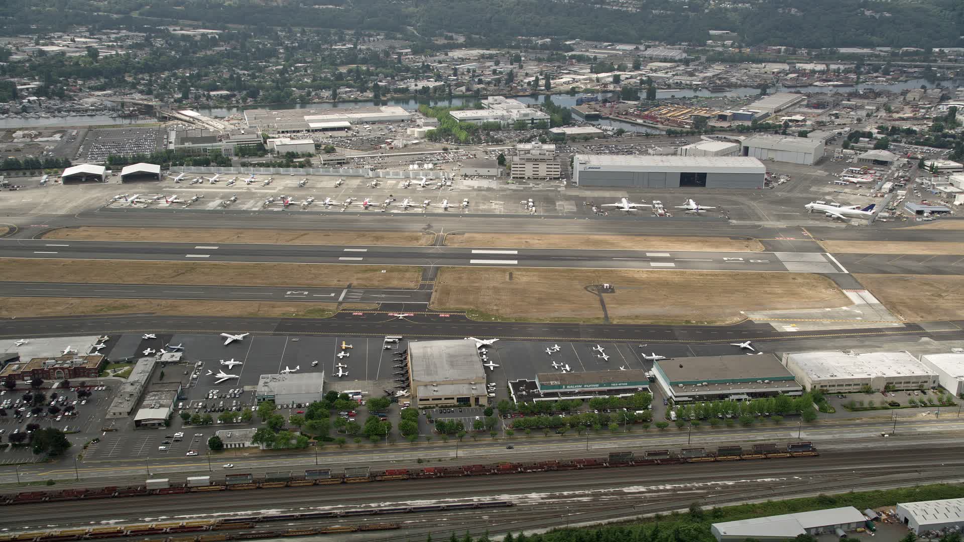 5K stock footage aerial video of parked commercial jets at Boeing Field ...
