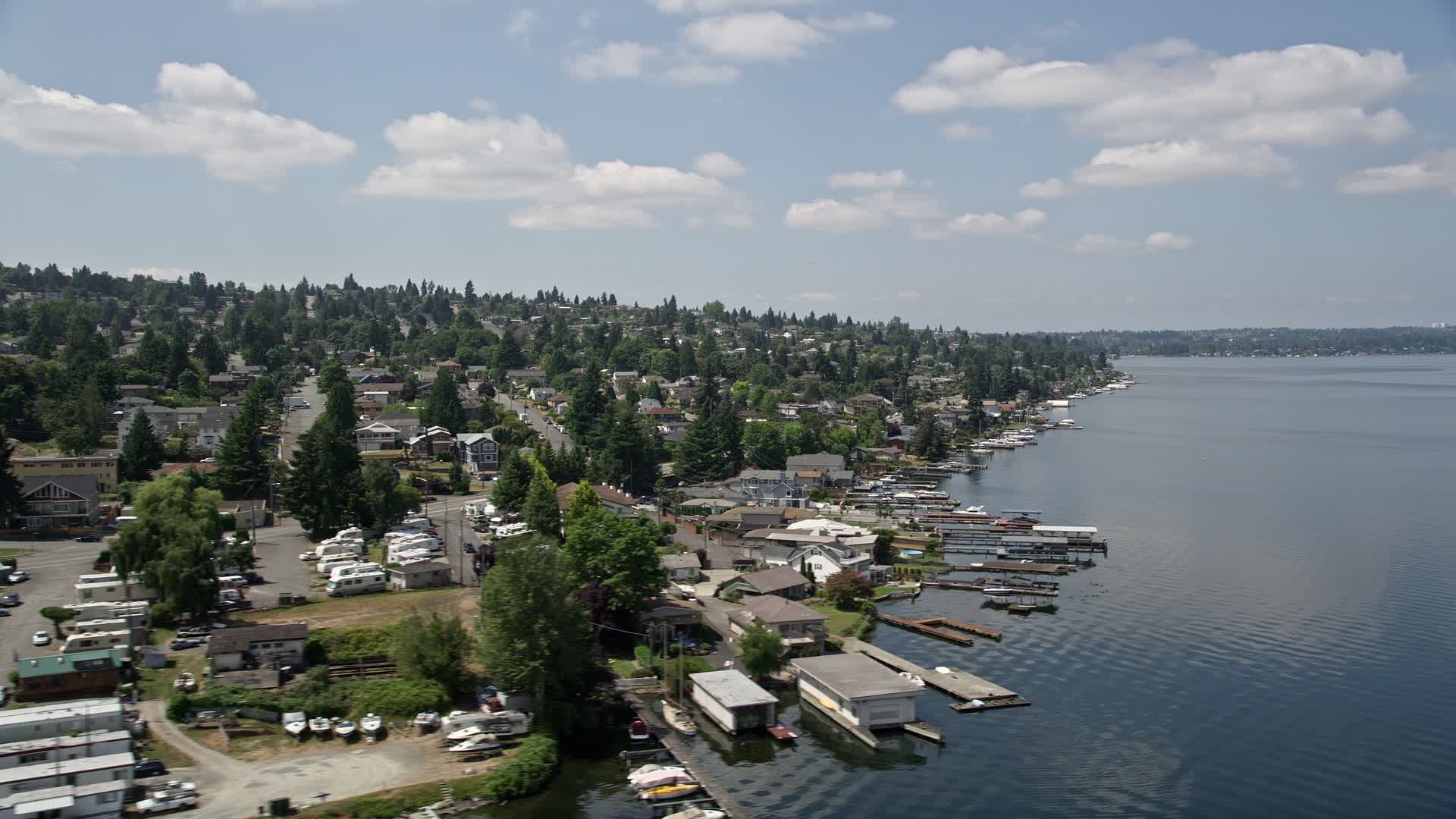 5K stock footage aerial video fly by lakeside homes with docks on Lake ...