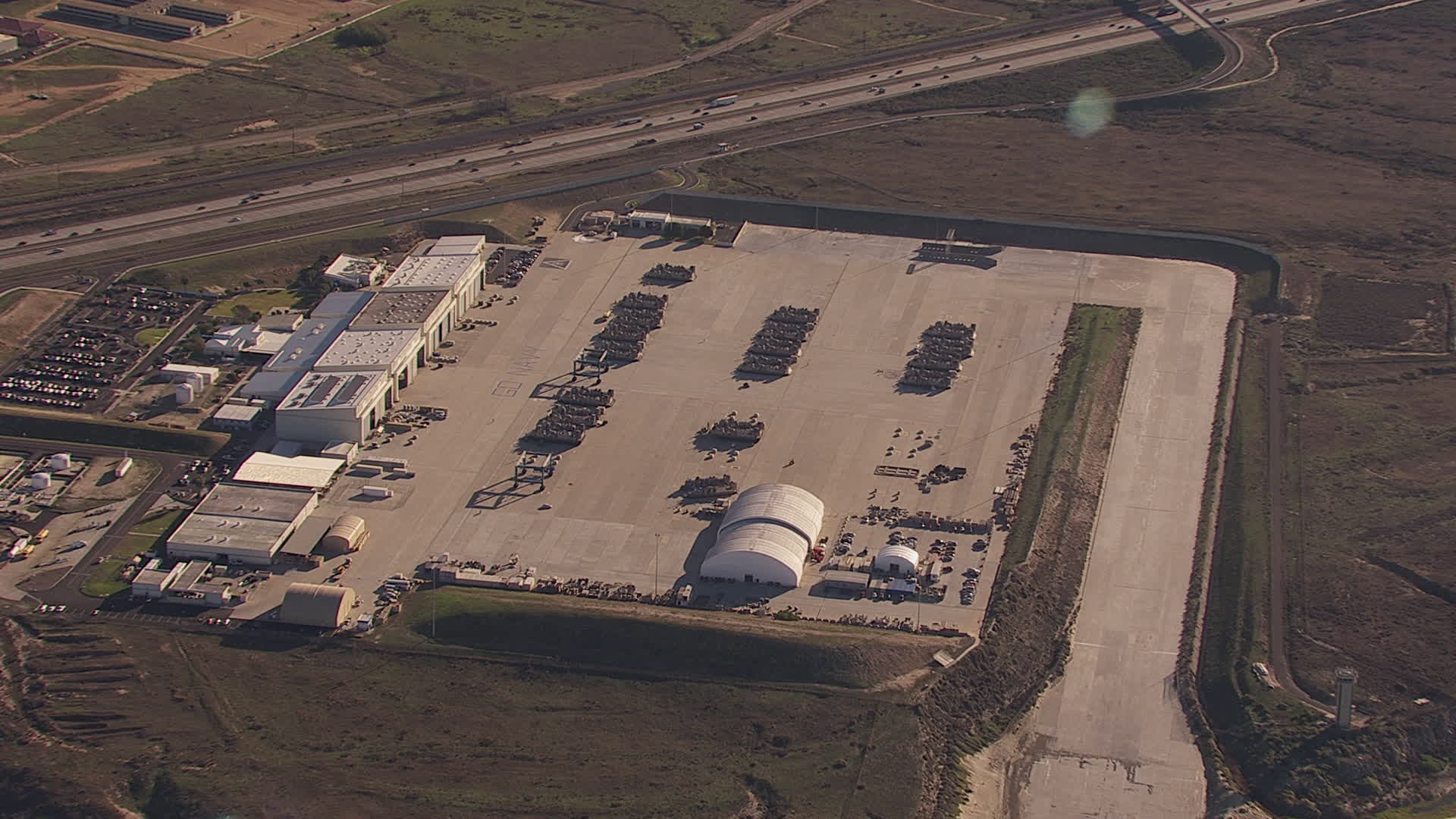 HD stock footage aerial video of flying away from military craft at ...