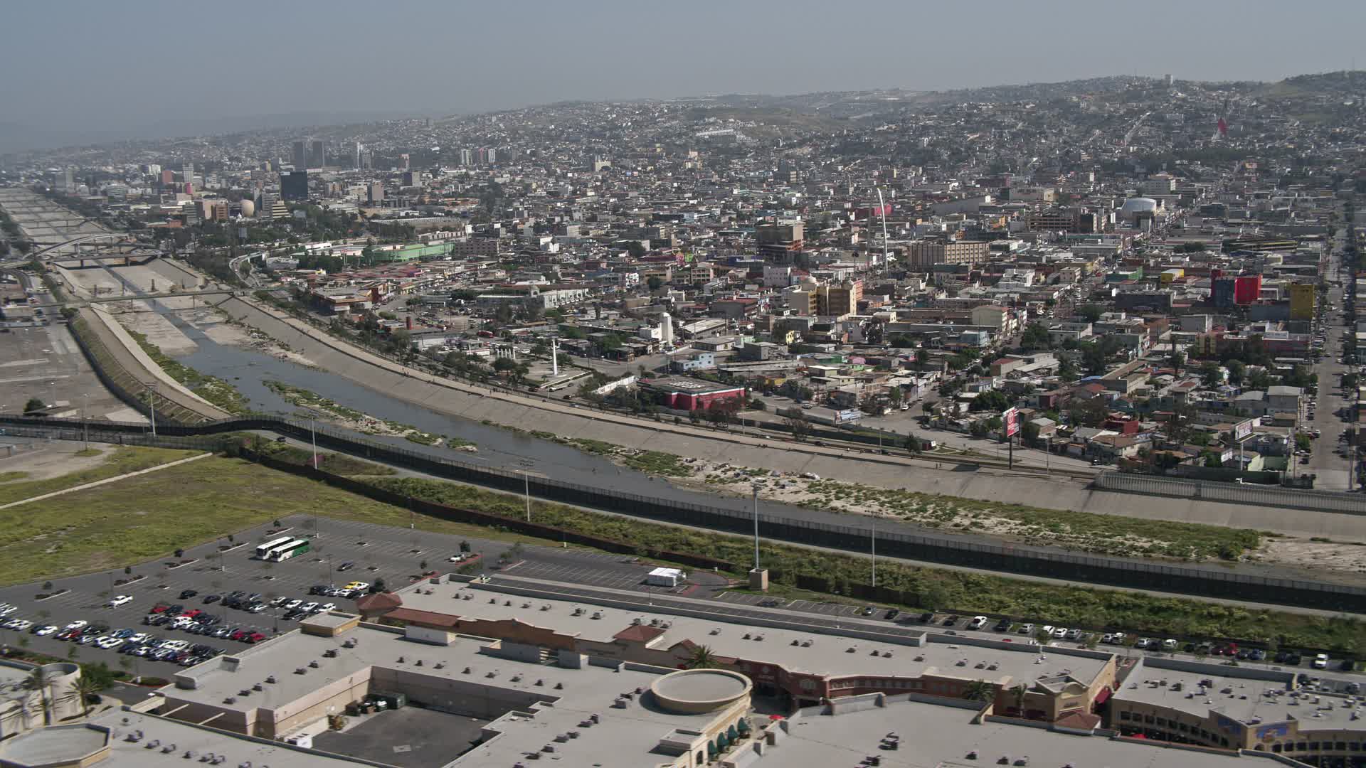 4K stock footage aerial video of the border fence and Rio Tijuana, US ...