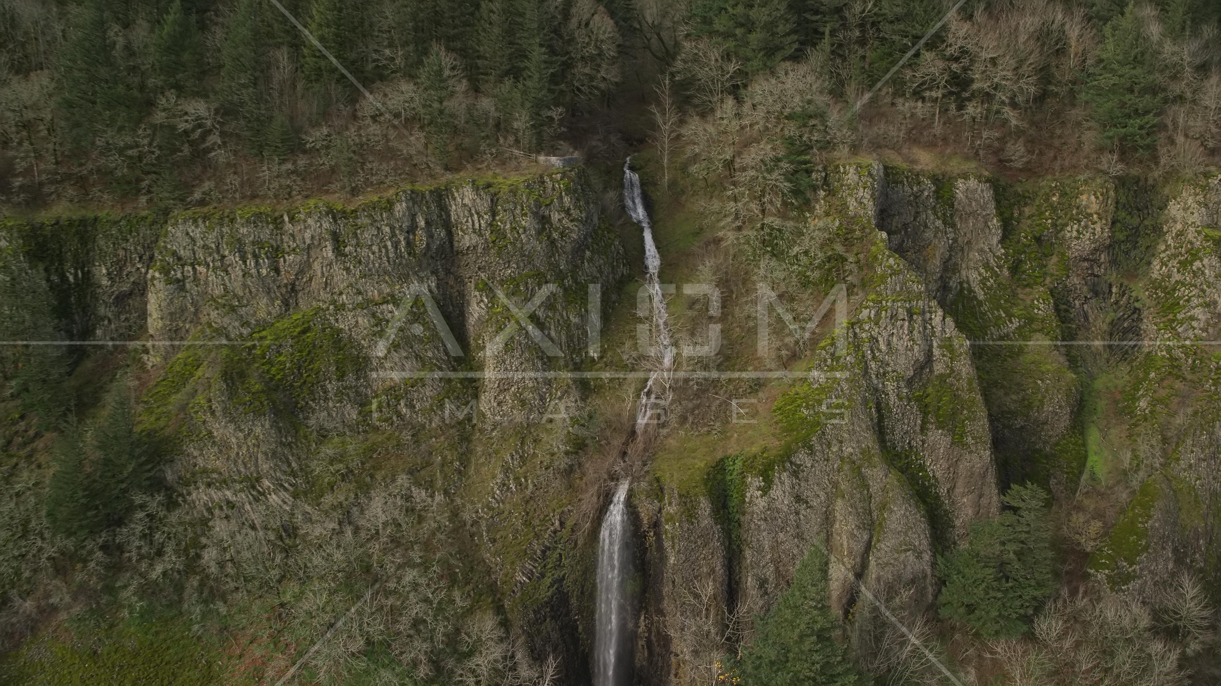 A waterfall on a steep cliff in Columbia River Gorge, Washington Aerial ...