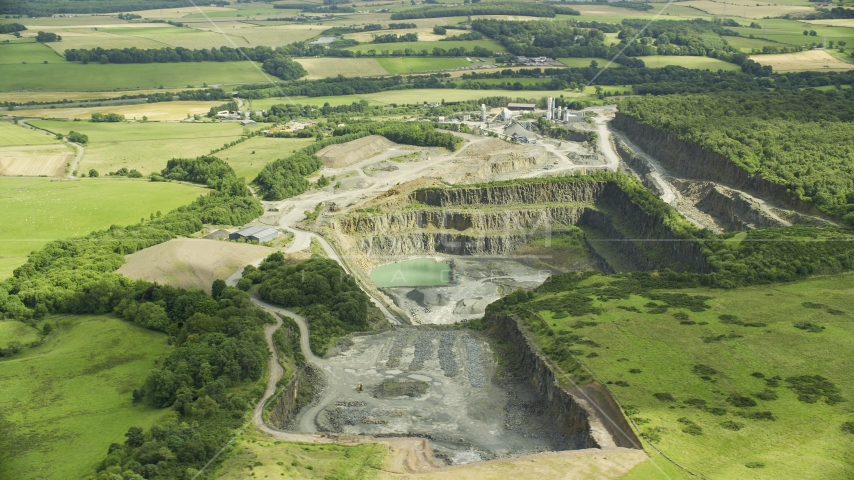 A quarry surrounded by farm fields, Denny, Scotland Aerial Stock Photo ...