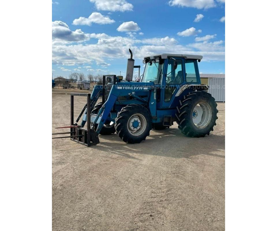 1988 Ford 7710 Tractor with Ford 777F Loader Bucket & Bale Fork Attachments