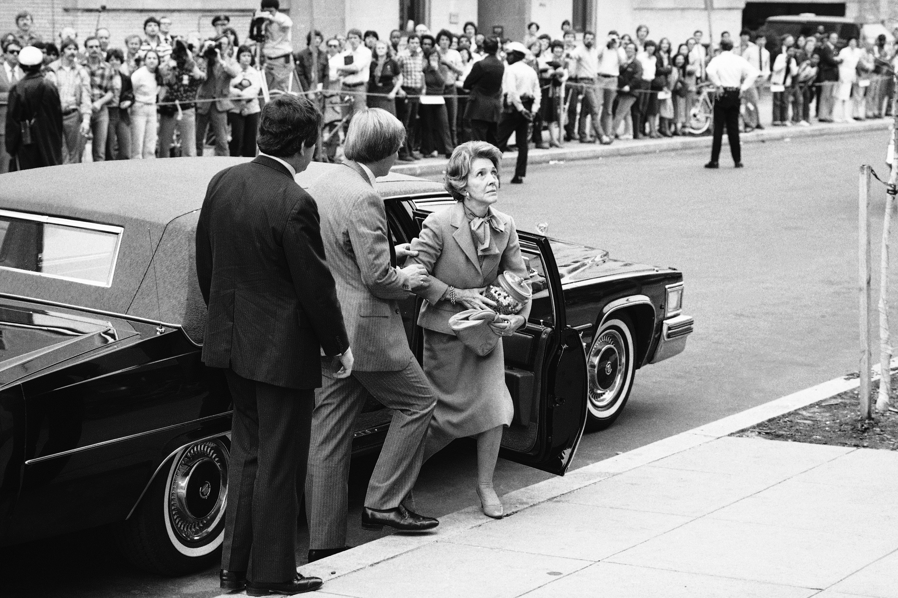 The first lady looks up at her husband's room at the George Washington ...